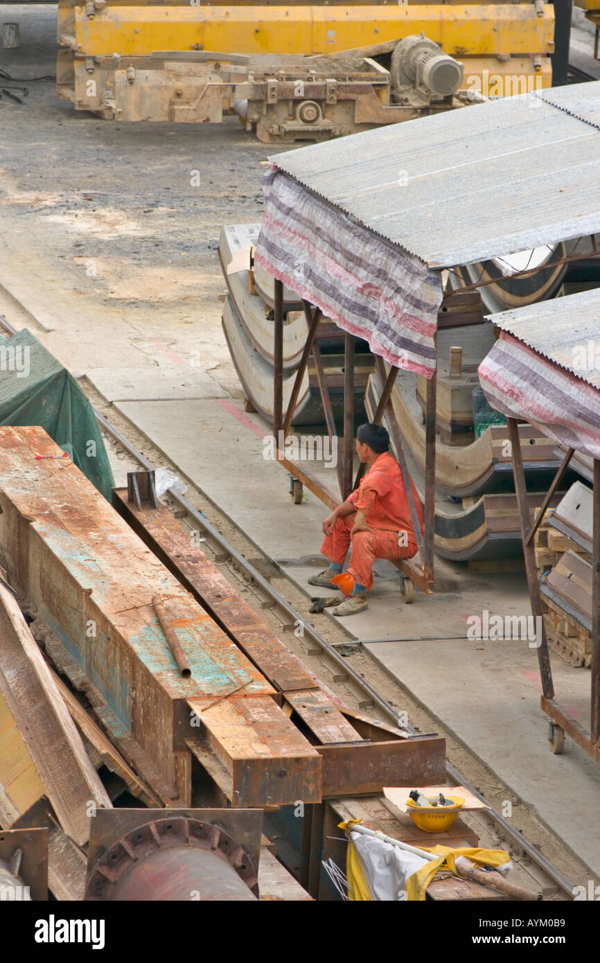 A construction worker taking a break in Shenzhen China Stock Photo - Alamy