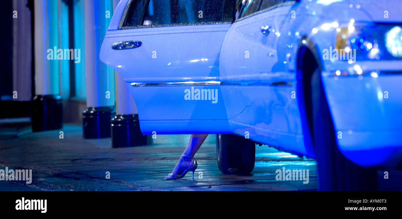 Lady getting out of Limousine Stock Photo - Alamy