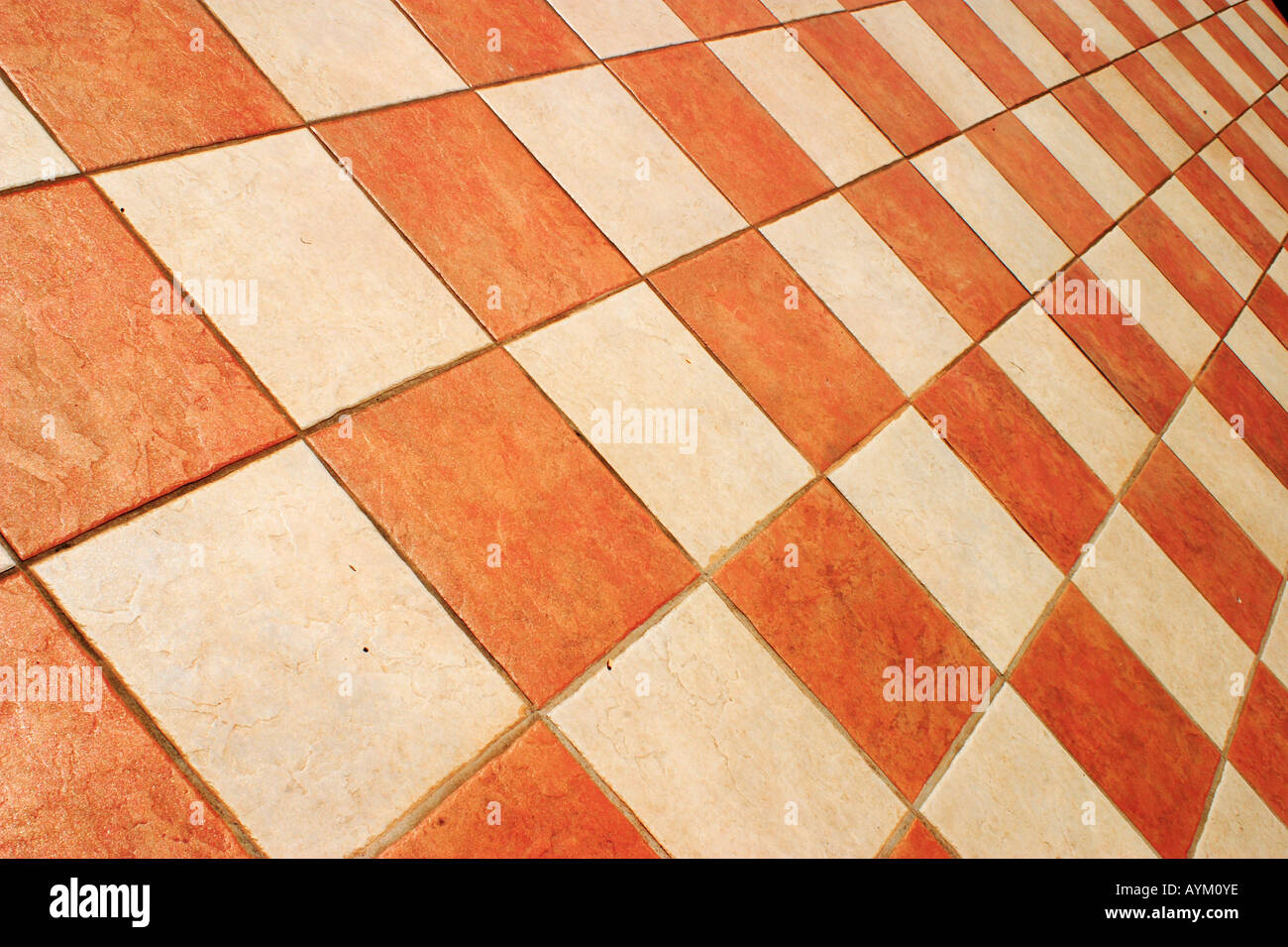 Terracotta and cream tiles in a checked pattern Stock Photo - Alamy