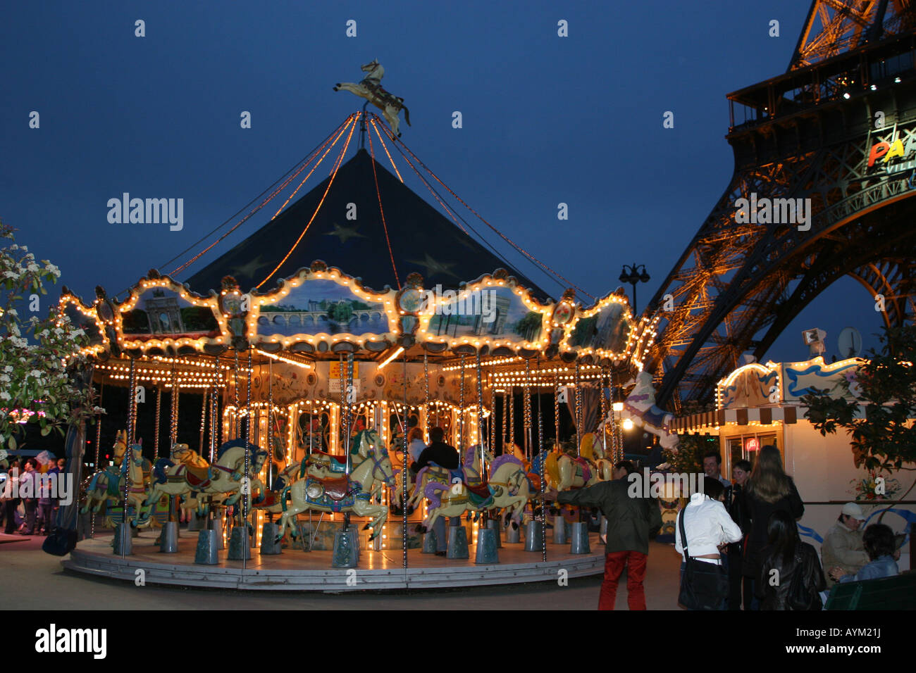Carousel at the base of the Eiffel Tower Paris France Stock Photo - Alamy
