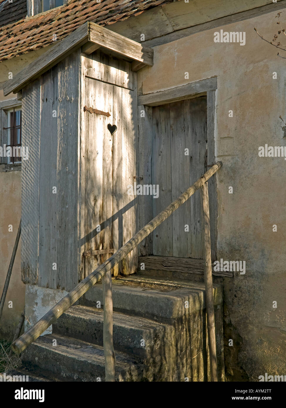 outhouse pit latrine at entrance to an old house in the Franconian open ...