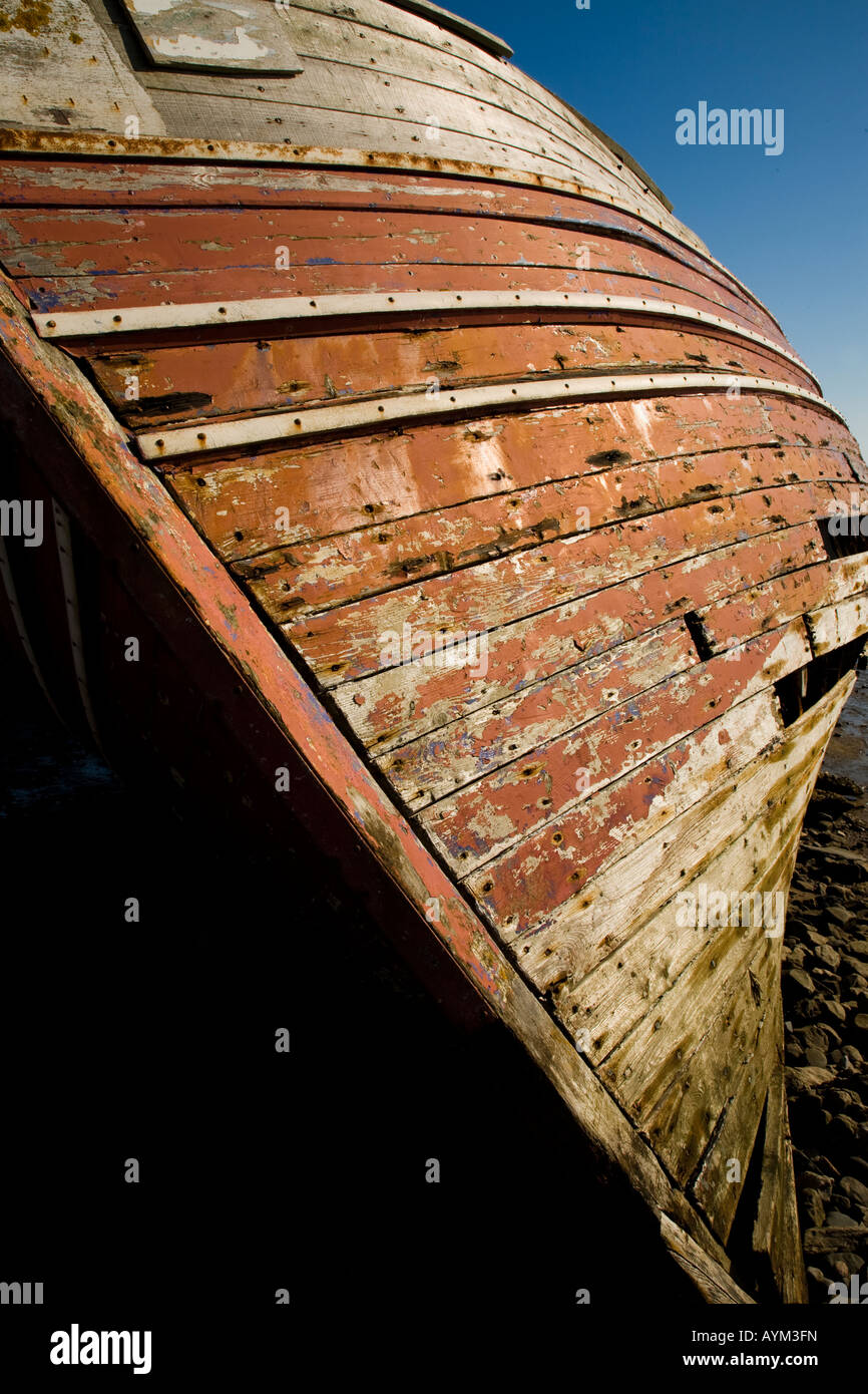 Wide angle view of the hull of a wrecked boat on the shore Stock Photo ...