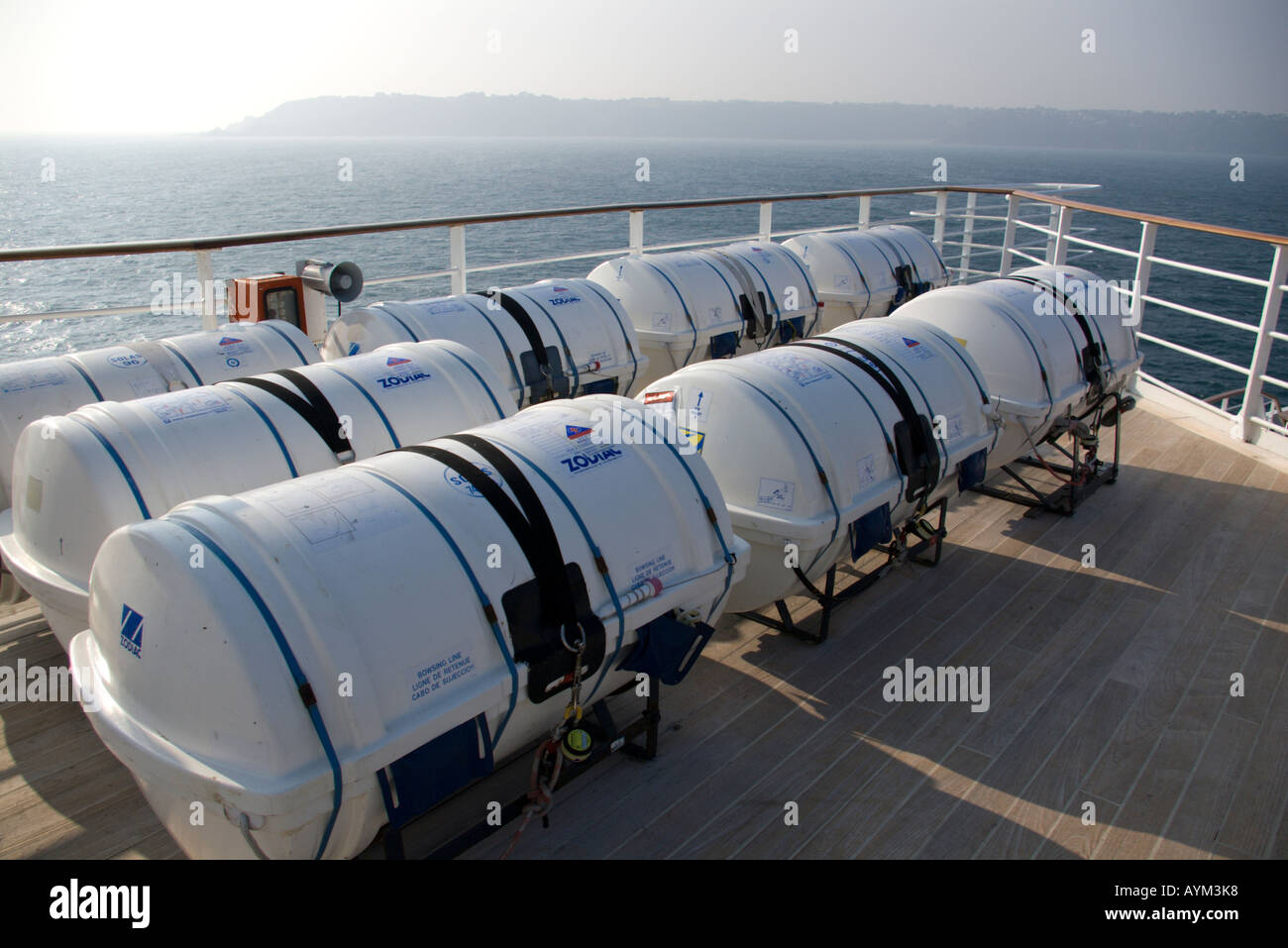 Detail of the original QE2 cruise ship life-rafts in containers on deck ...