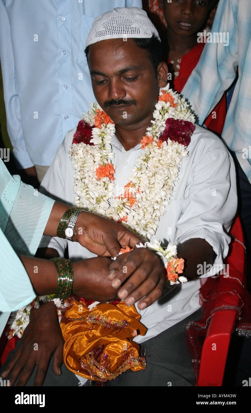 Muslim groom receives flowers the night before marriage in a ceremony ...