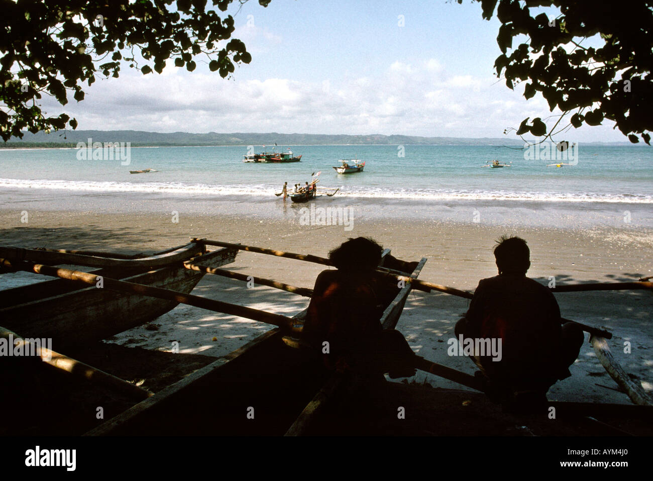 Indonesia Java Pangandaran Bay beach fishing boats Stock Photo - Alamy
