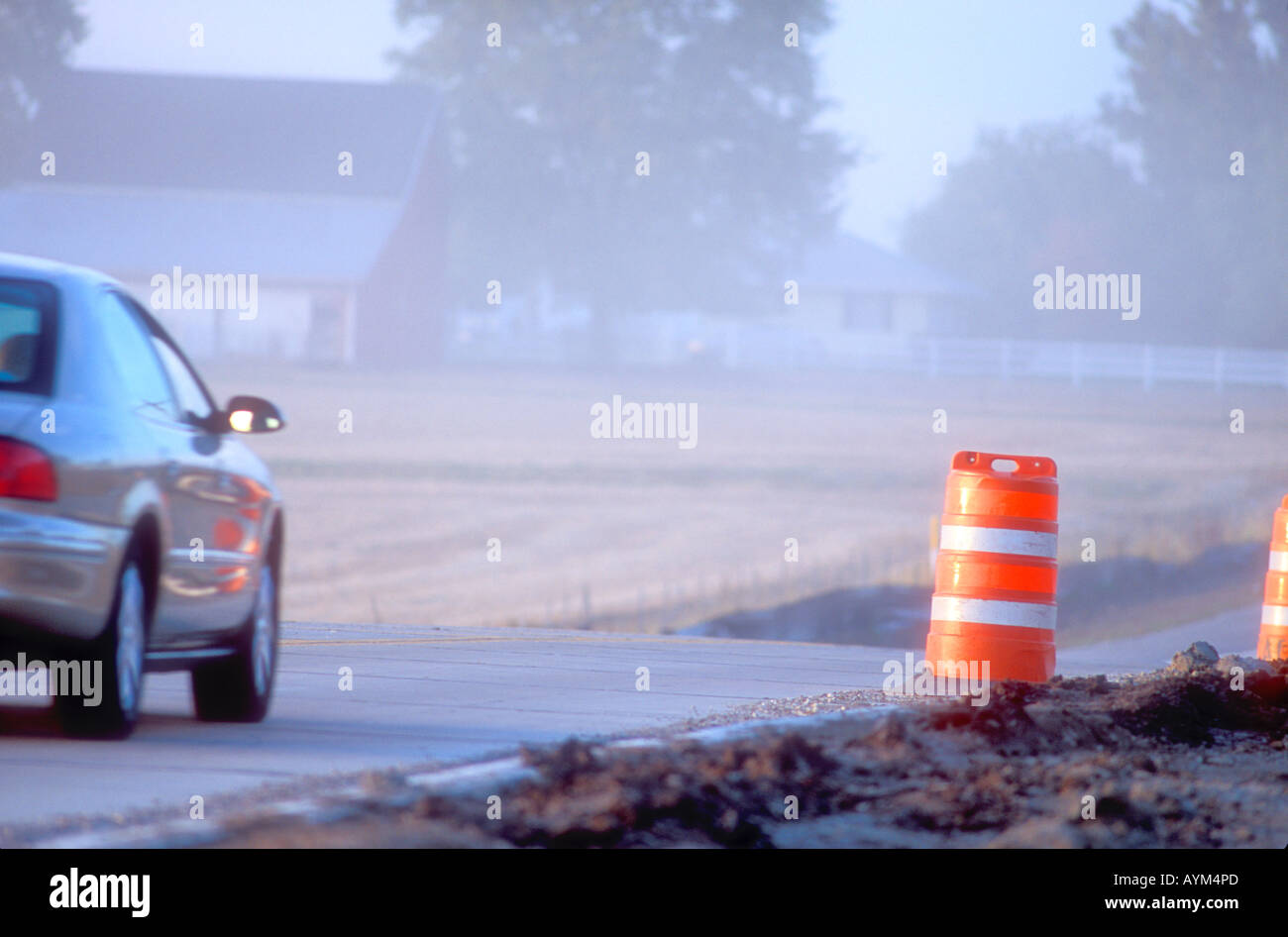 Orange safety barrels or cones to warn motorists of road construction ...