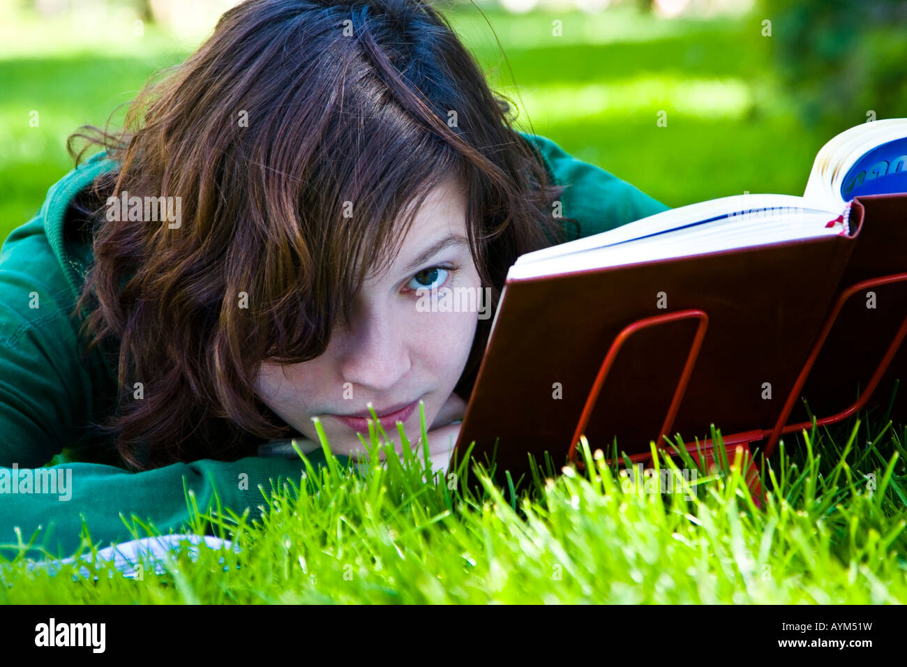 Woman with book reading in the park Stock Photo - Alamy