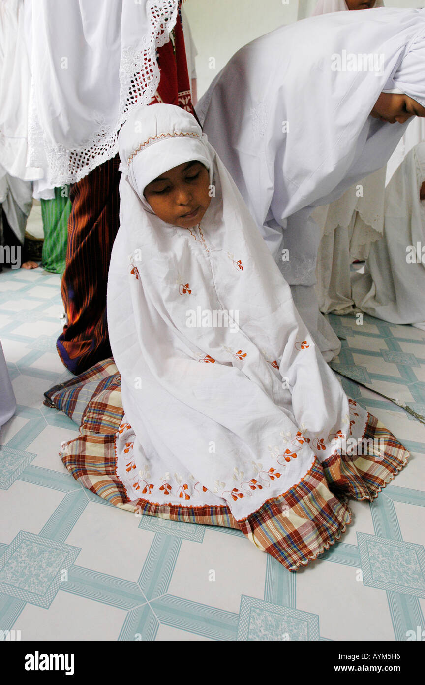 A young muslim girl in Aceh Indonesia during her prayer Stock Photo - Alamy