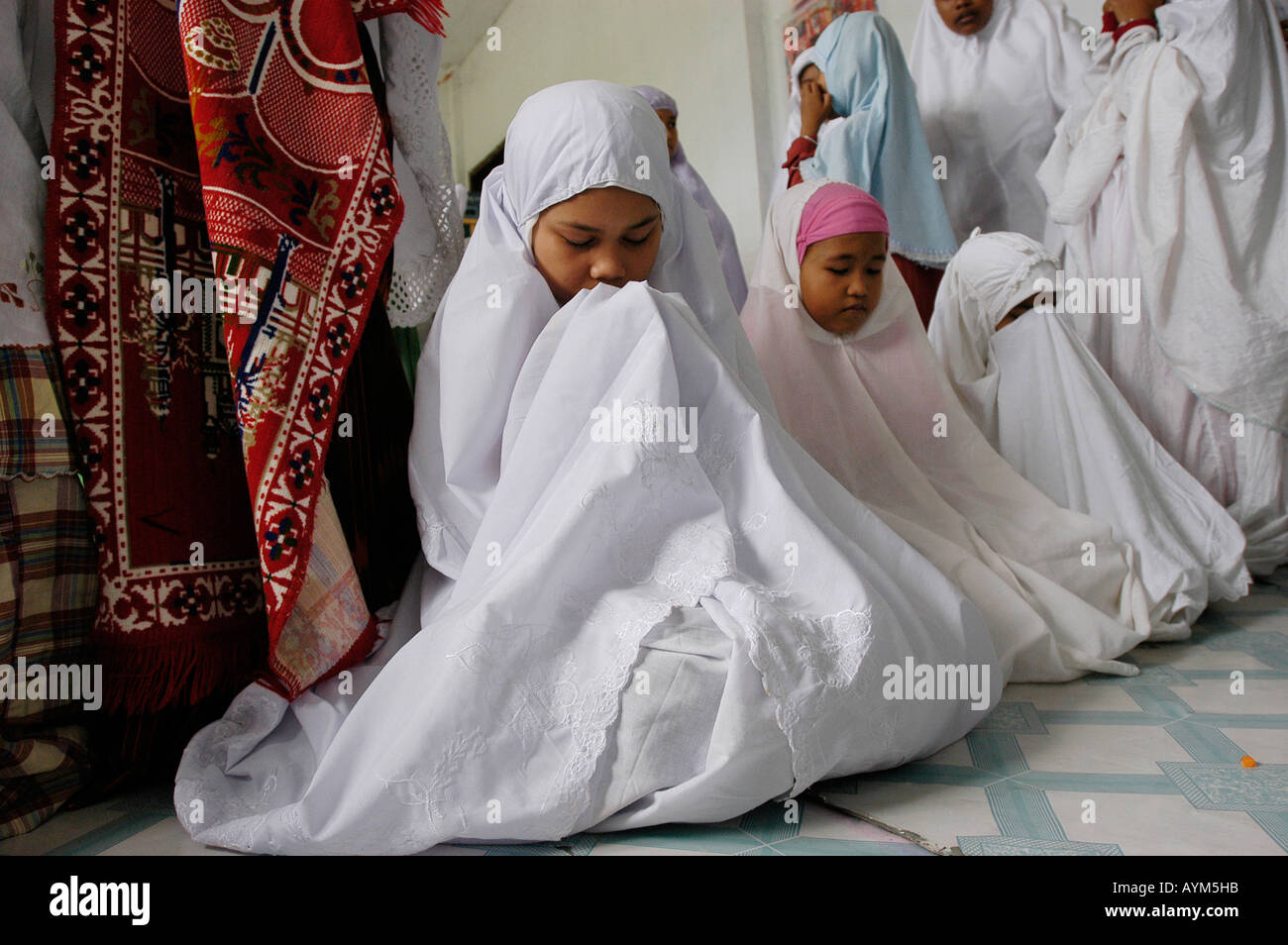Muslim girls in Banda Aceh Indonesia during their midday prayer Stock ...