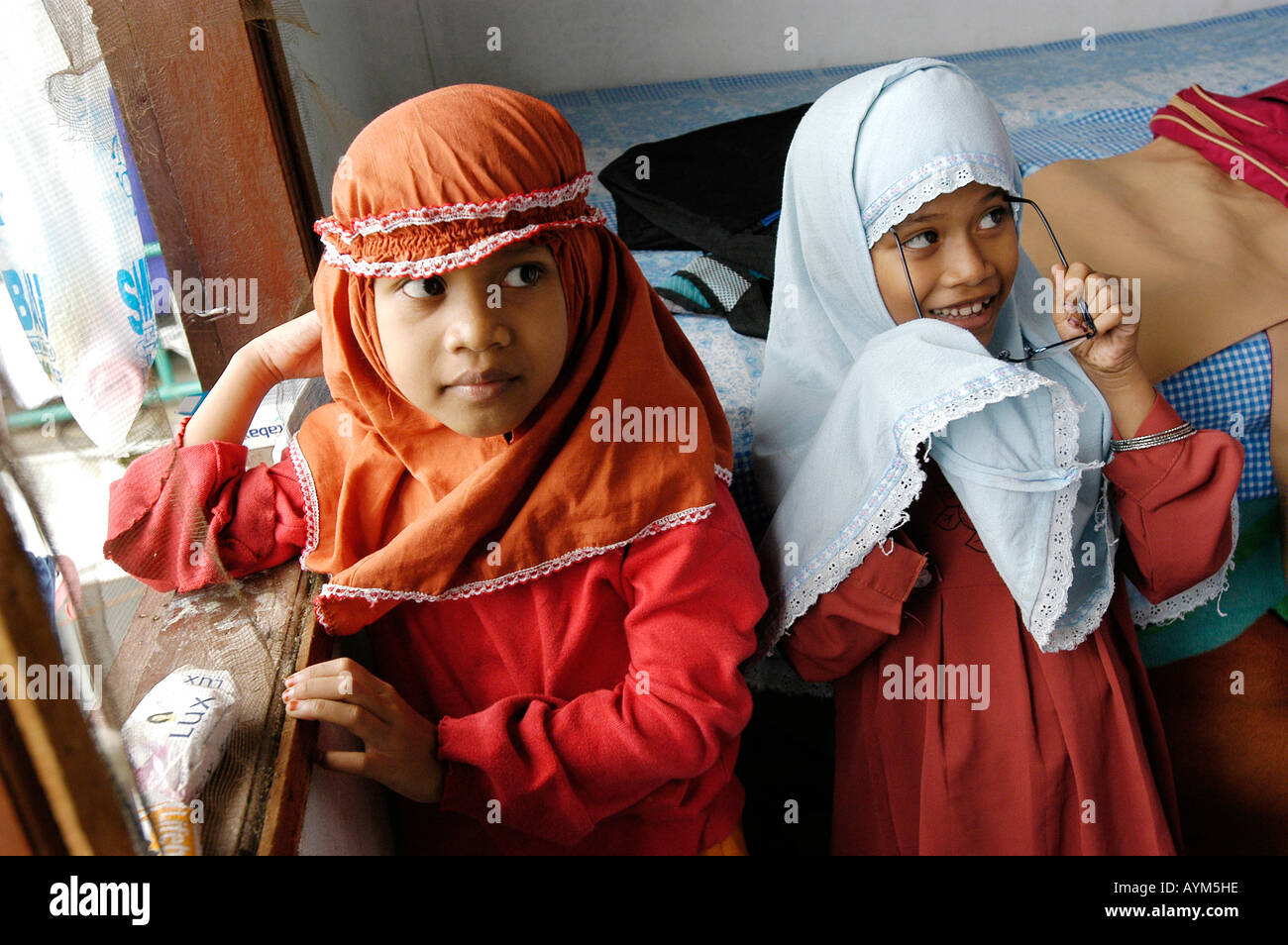 Two orphan muslim girls in Banda Aceh Indonesia Stock Photo - Alamy