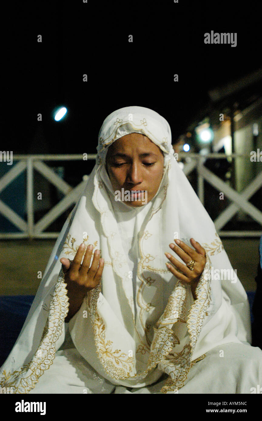 A young muslim girl in Banda Aceh Indonesia is praying Stock Photo - Alamy