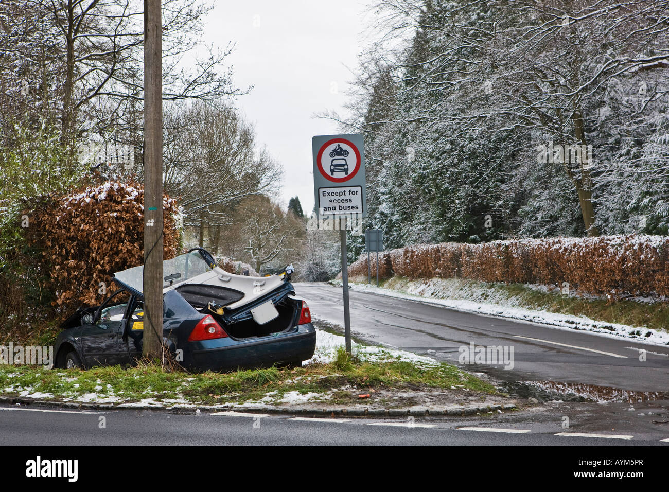 Crashed Car by Road Sign Limiting Access Stock Photo - Alamy