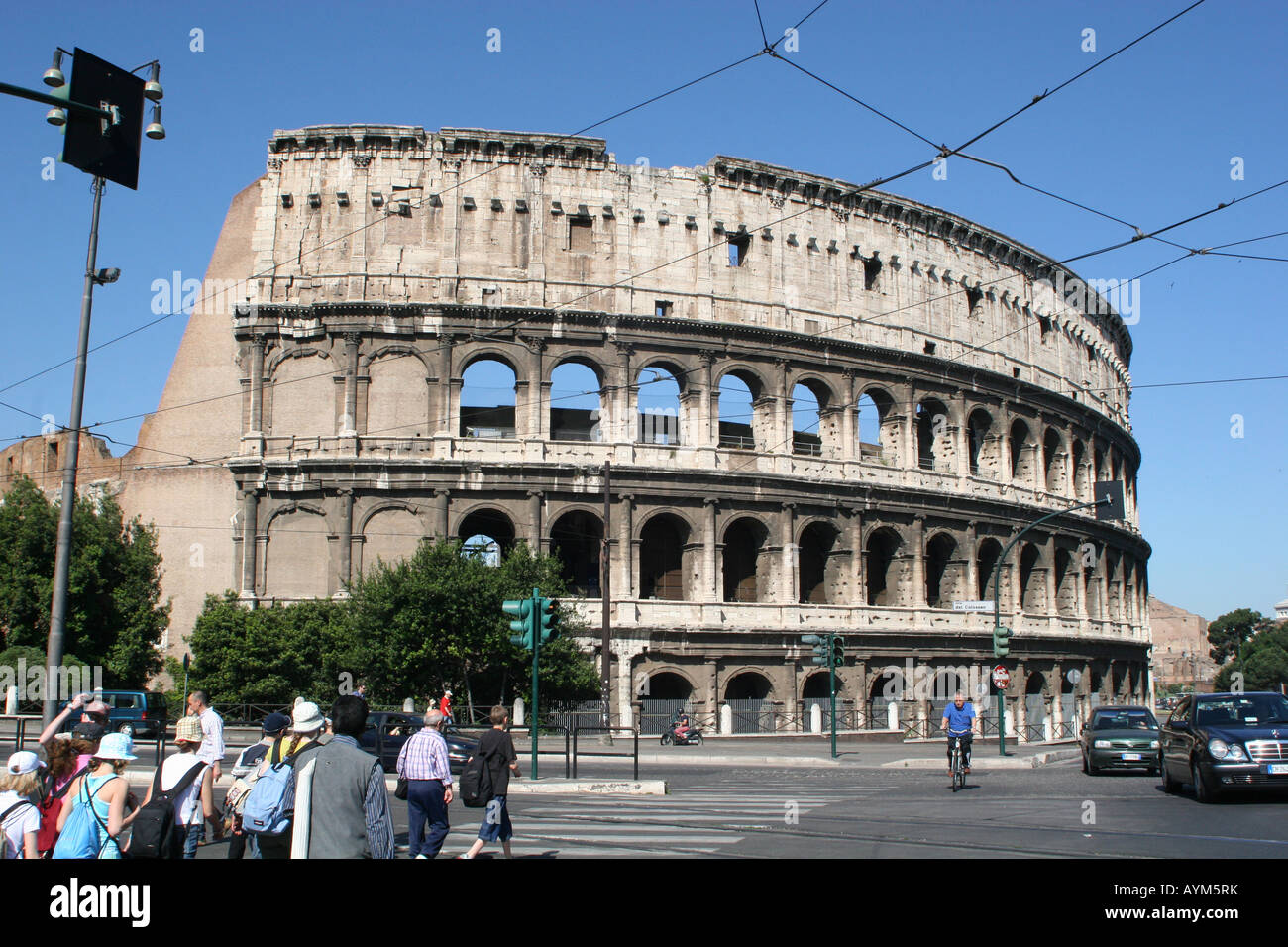 Tourists cross the street to visit the Coliseum Rome Italy Stock Photo ...