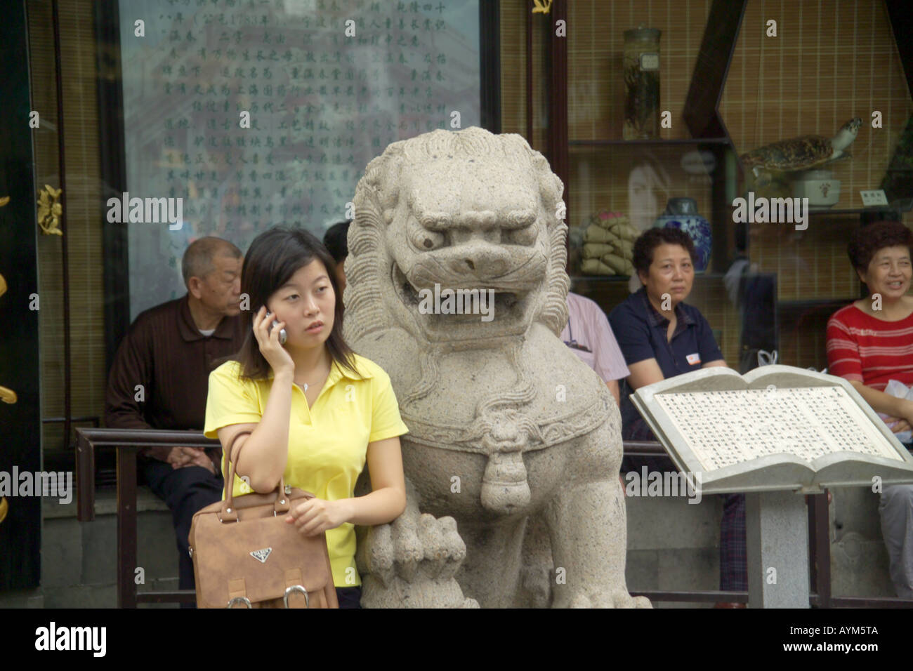 Chinese girl using mobile phone in Shanghai Stock Photo - Alamy