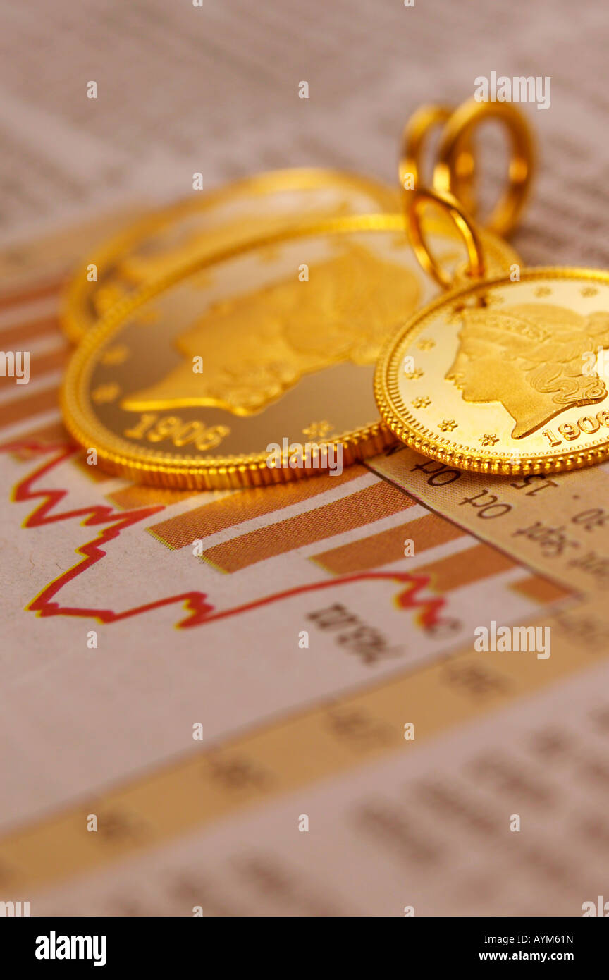 A heap of gold coins with graph Stock Photo - Alamy