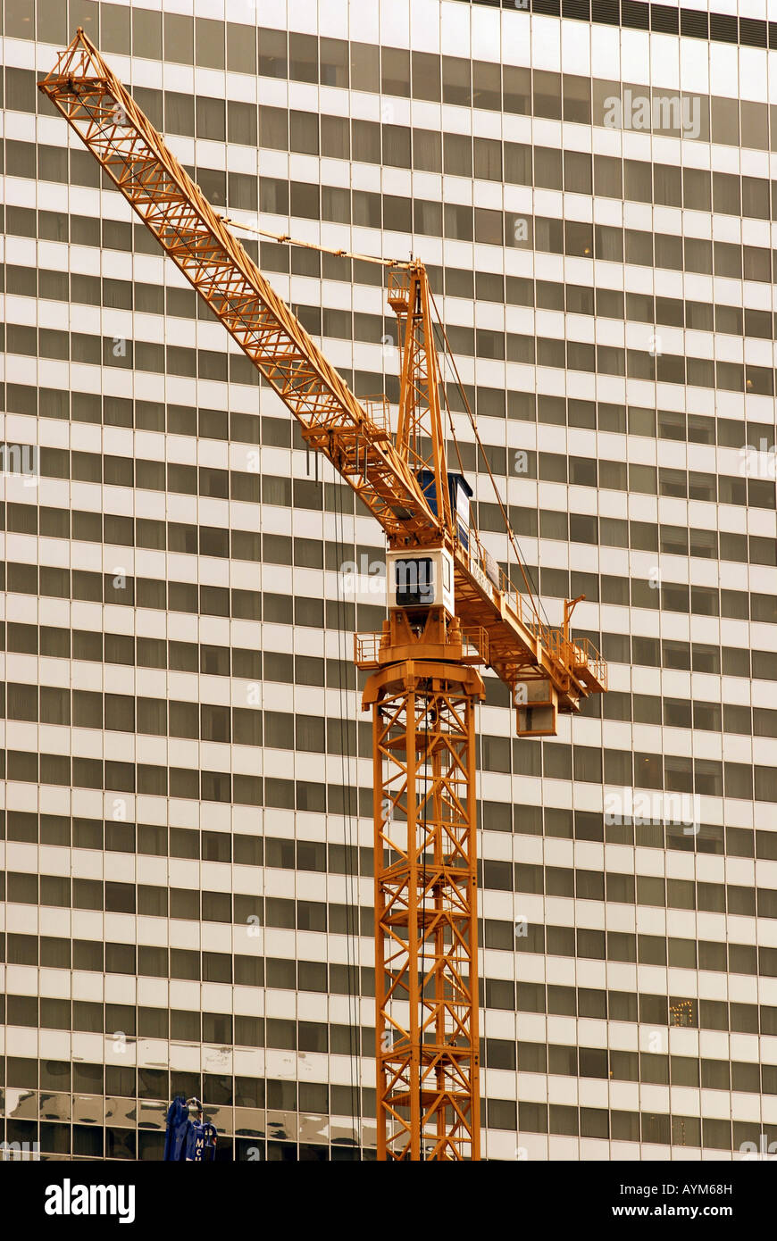 An orange tower crane at a construction site in Chicago Stock Photo - Alamy
