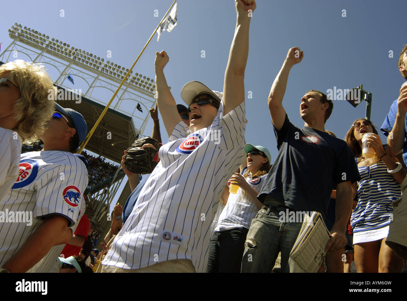 Chicago Cub baseball fans celebrate a victory at Wrigley Field in ...