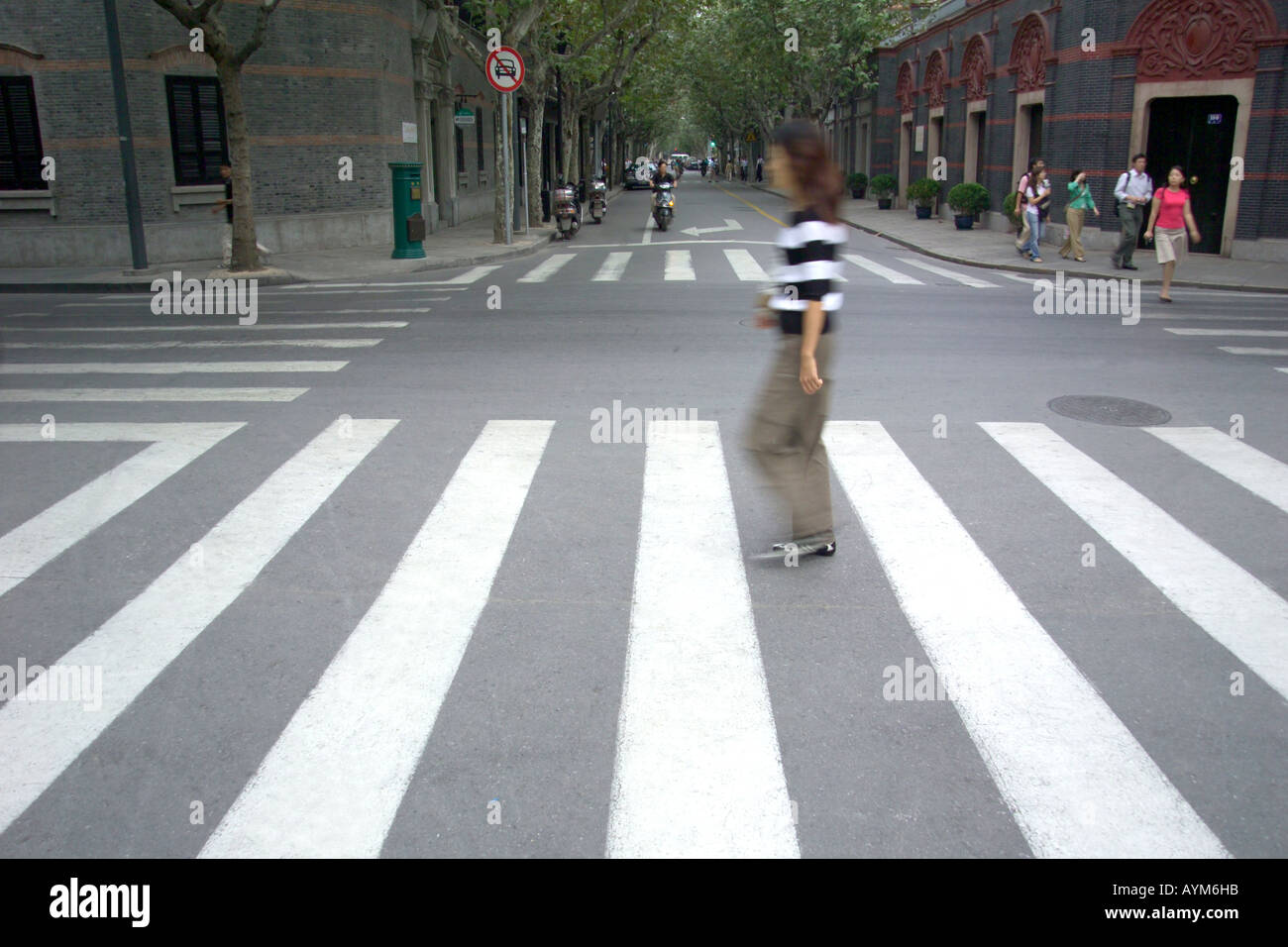 walking across a zebra crossing Stock Photo - Alamy