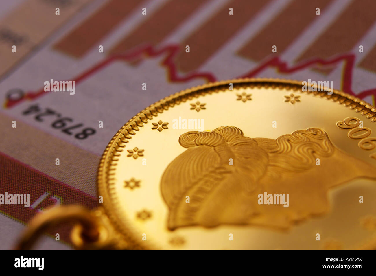 Gold coin on a graphic Stock Photo - Alamy