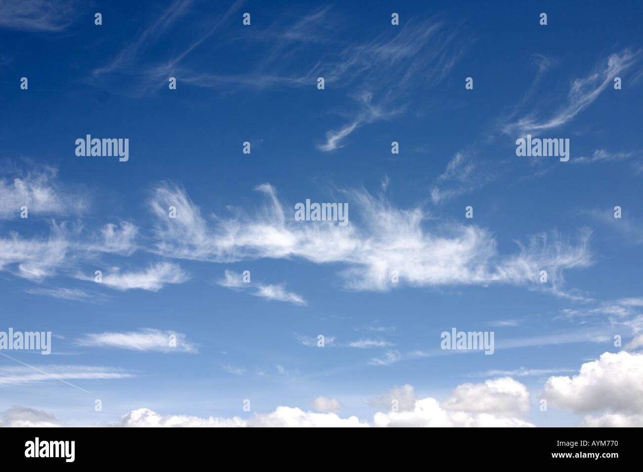 Cirrus and cumulus clouds in a blue sky Stock Photo - Alamy