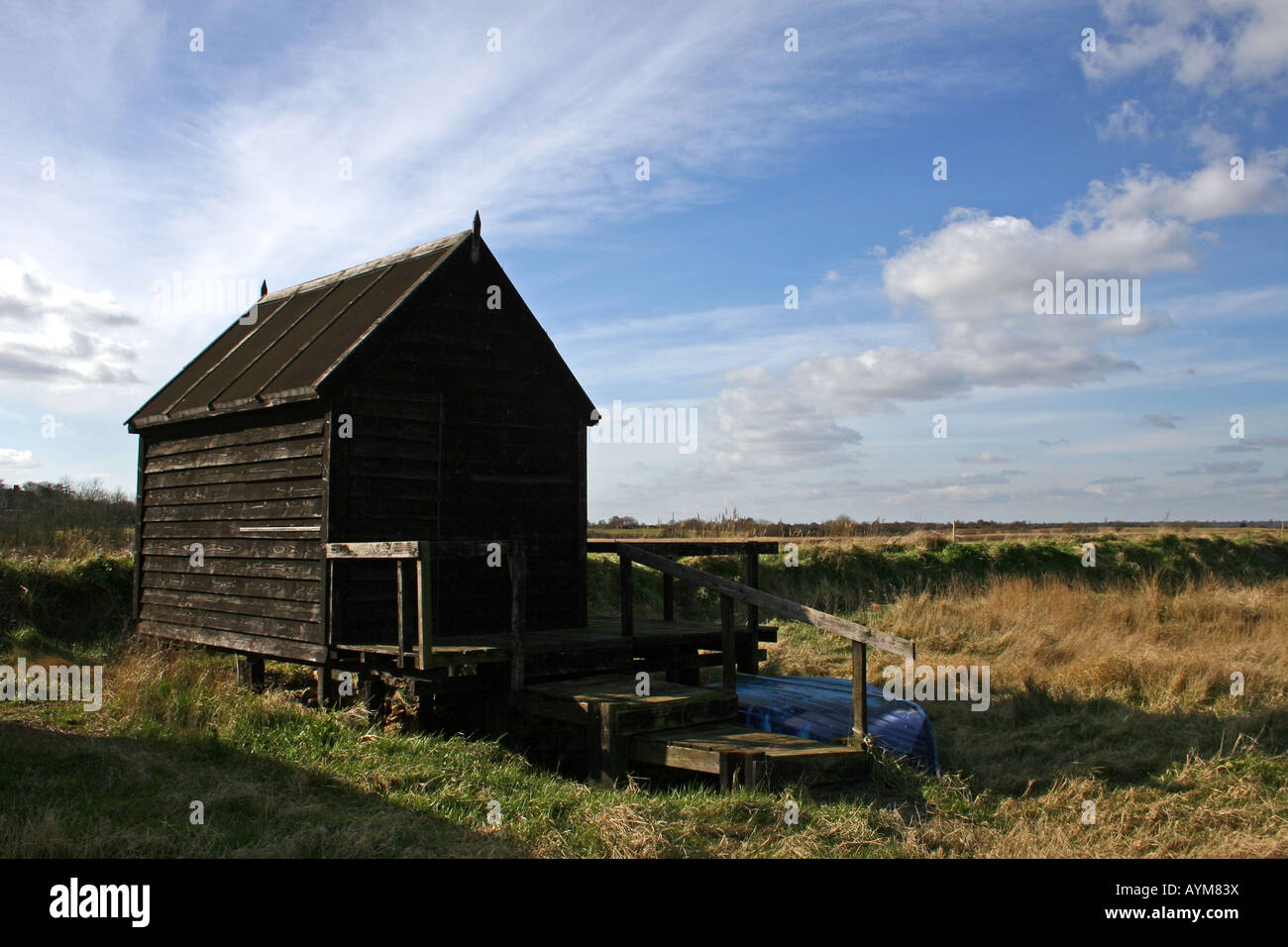 OLD BEACH HUT BESIDE THE RIVER BLYTH AT WALBERSWICK. SUFFOLK. ENGLAND ...