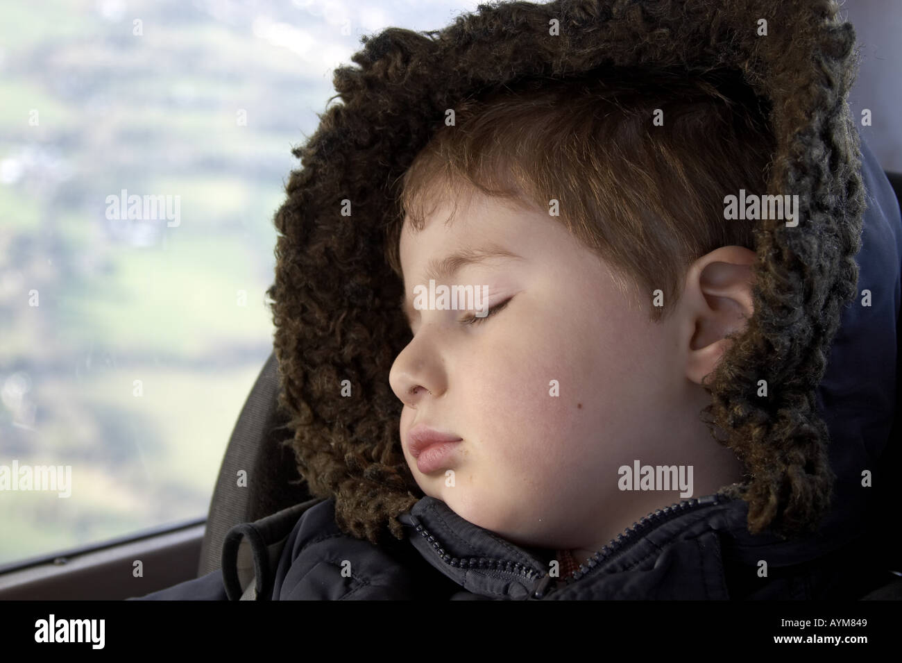 Young boy asleep in light aircraft Stock Photo - Alamy