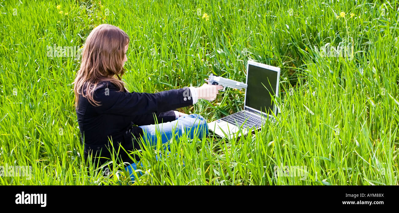 Blode businesswoman firing her laptop computer Stock Photo - Alamy