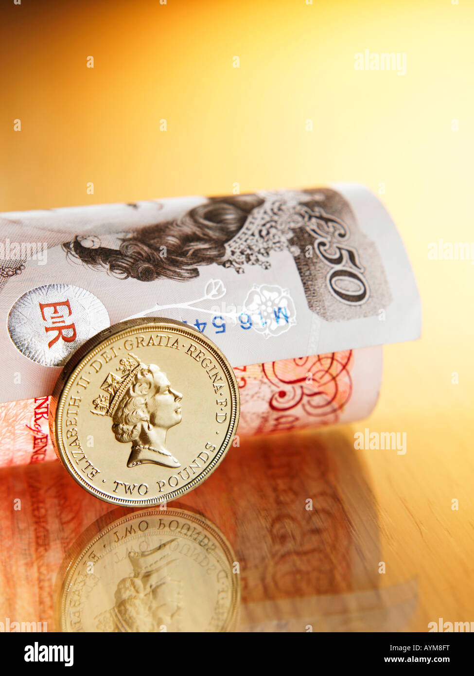 Rolled bank note uk hi-res stock photography and images - Alamy