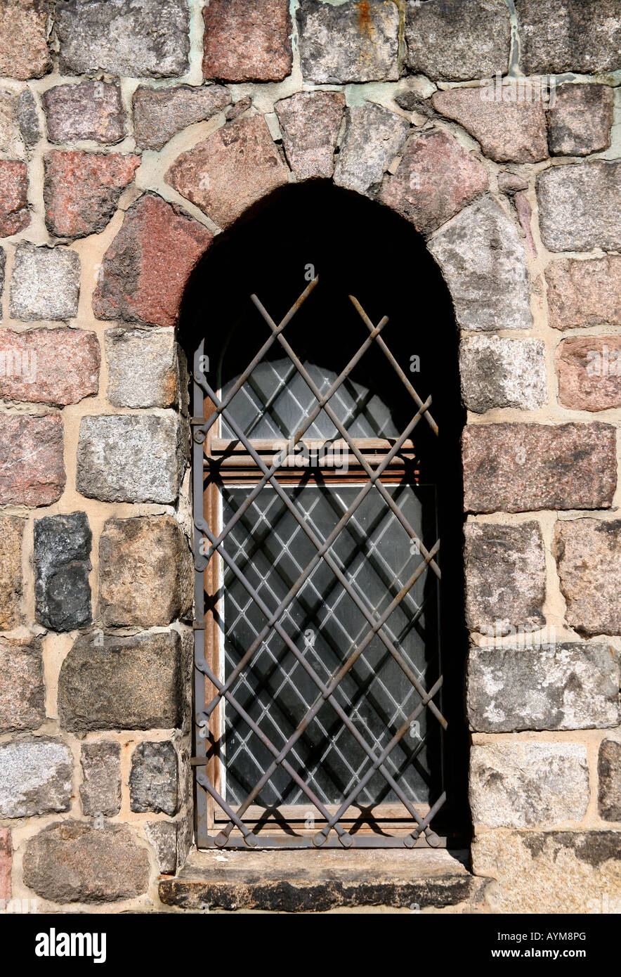 A historic church window, carved arch frame and decretive metal ...