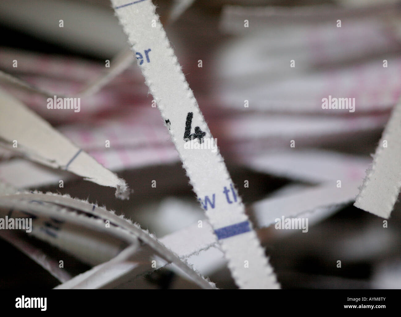 Shredded paper showing printed number four still visible Stock Photo ...