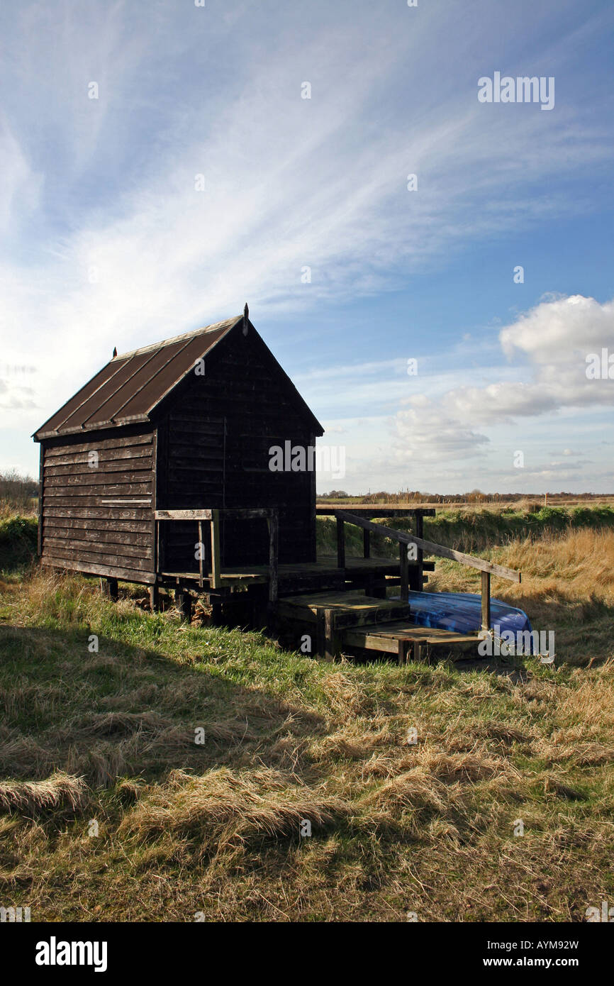 OLD BEACH HUT BESIDE THE RIVER BLYTH AT WALBERSWICK. SUFFOLK. ENGLAND ...