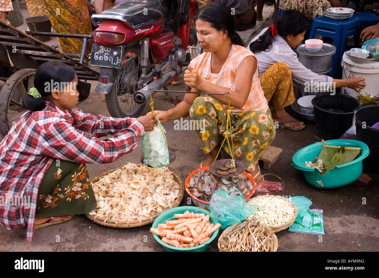 Stock photograph of a buyer and vendor in the market at Mandalay in ...