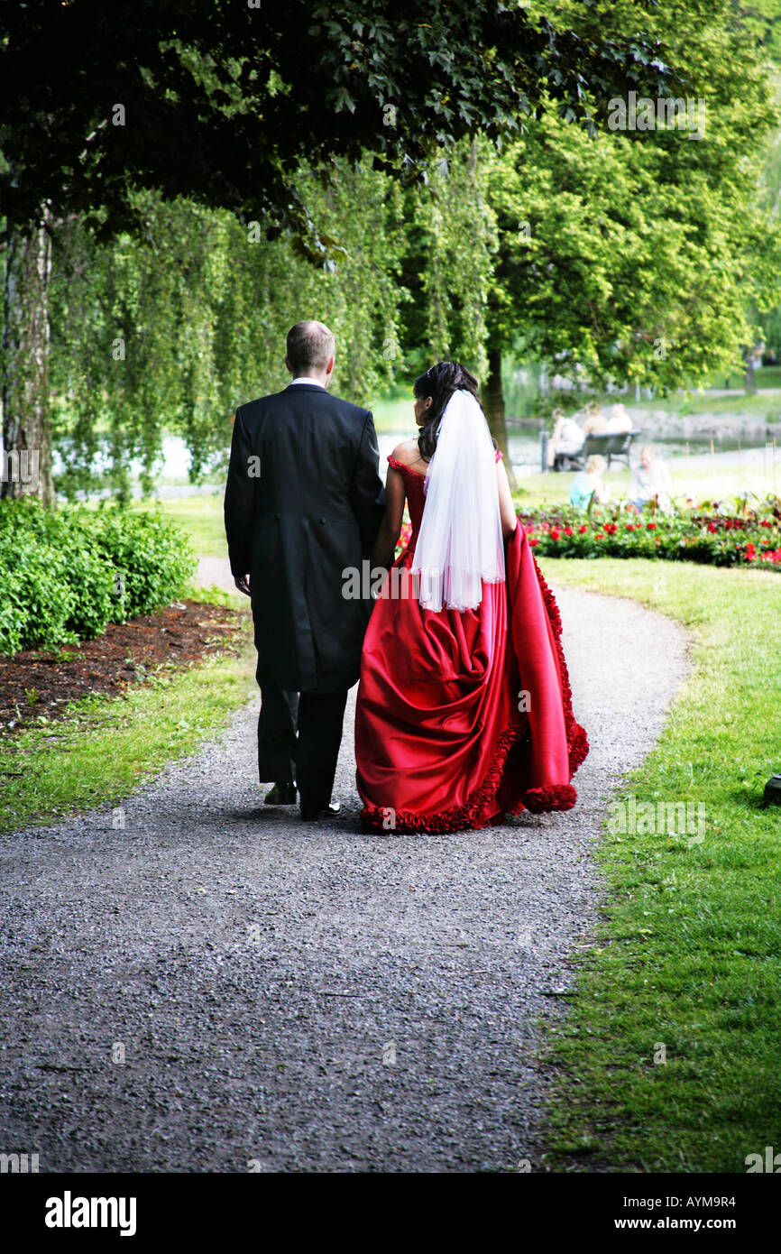 Bride and groom walking Stock Photo - Alamy