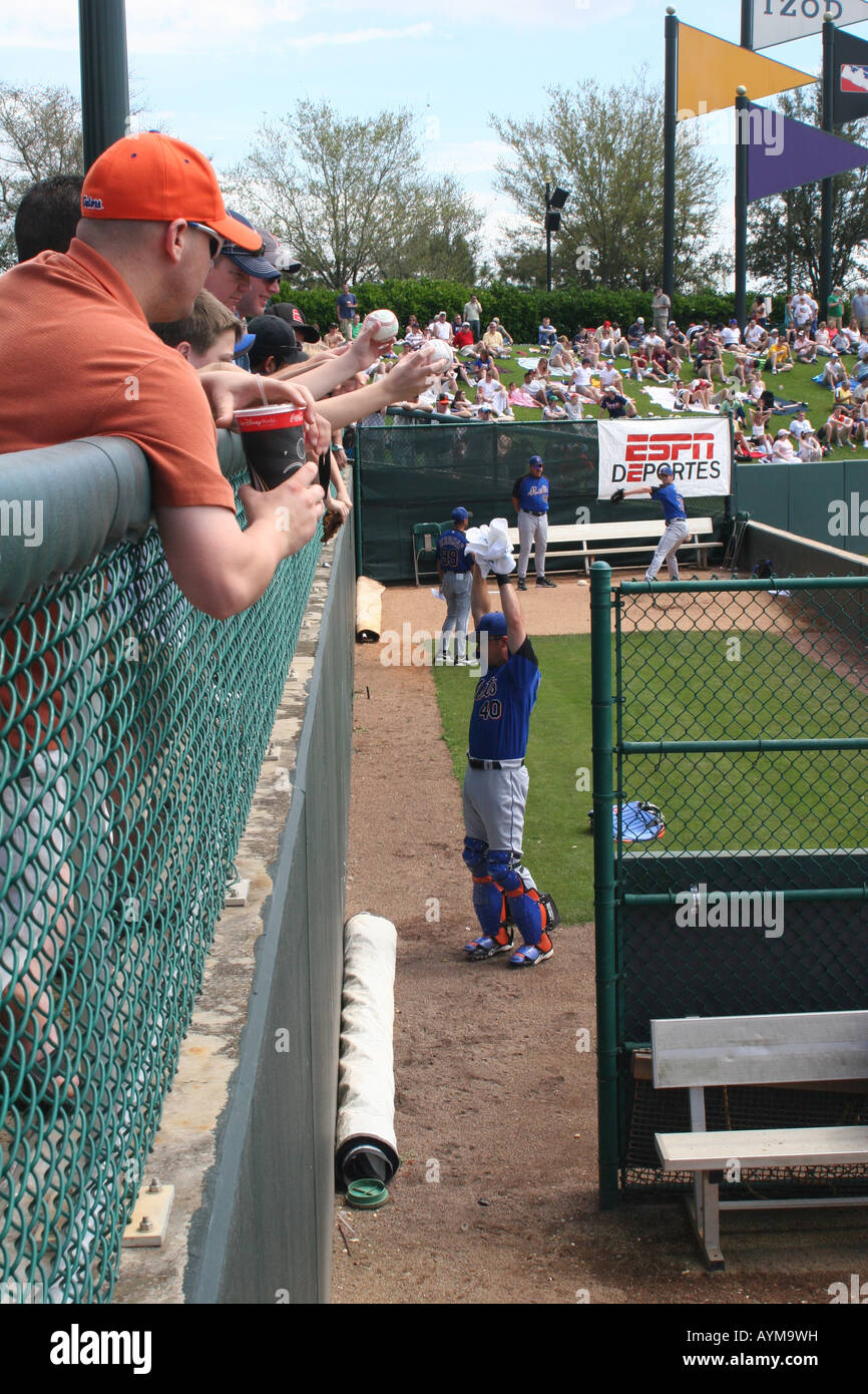 Baseball fans wanting autographs from players in the dugout Disney s ...