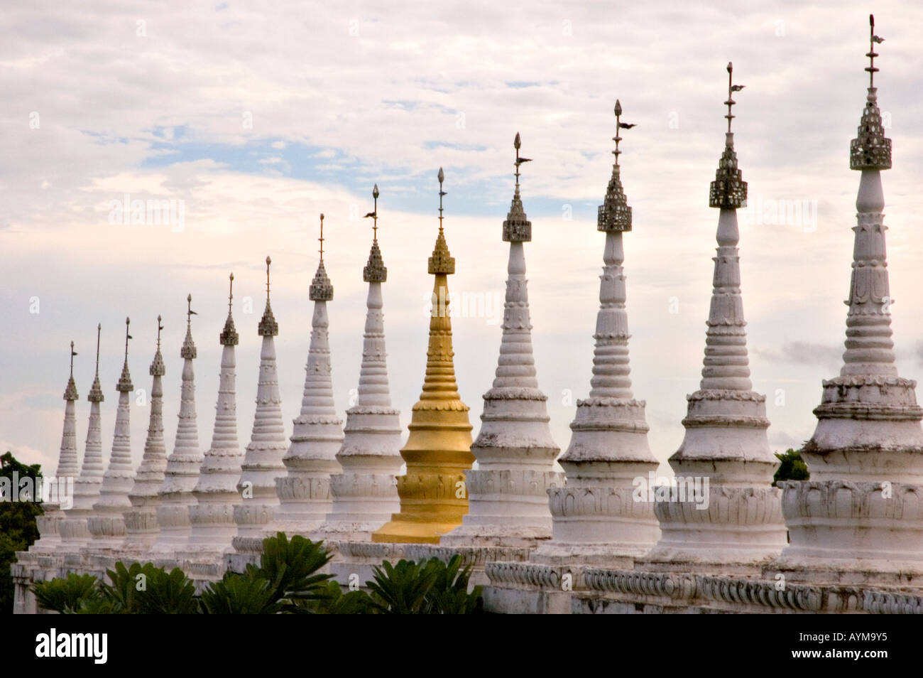 Stock photograph of a line of chedis at the Aung Setkya Paya in Myanmar ...