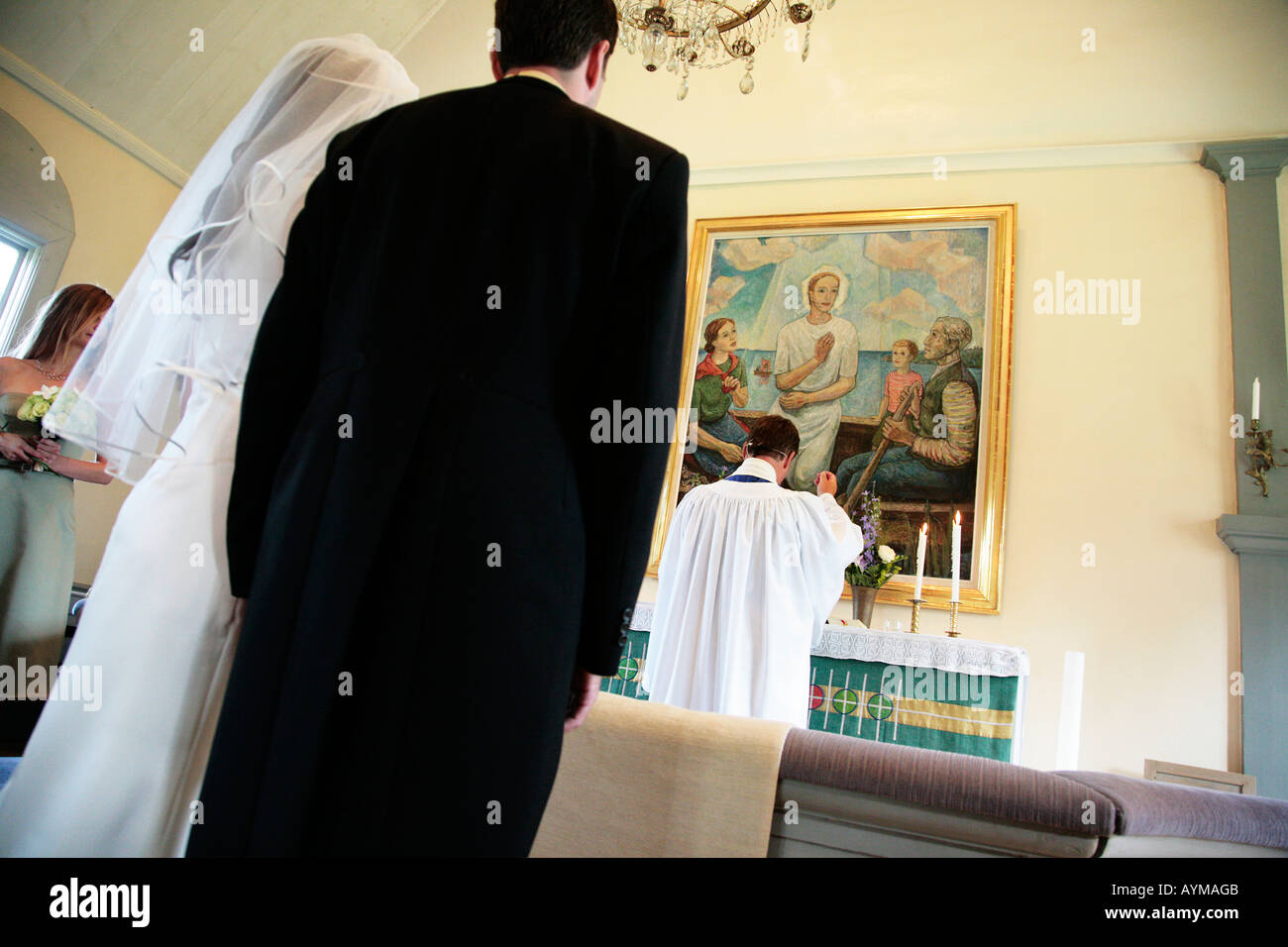 Priest blessing the rings at the altar Stock Photo - Alamy