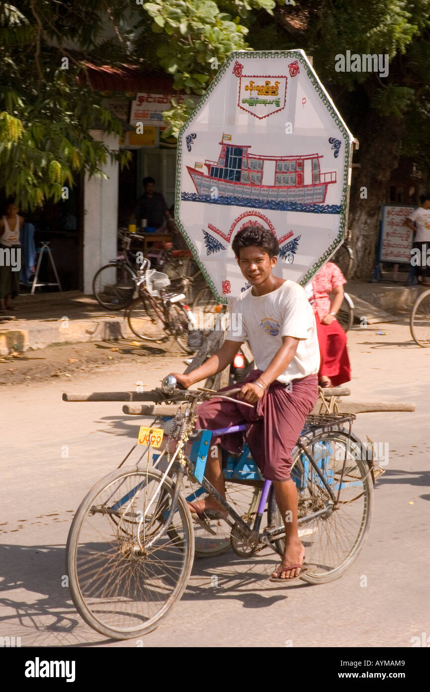 Stock photograph of a trishaw carrying offerings in a street parade at ...