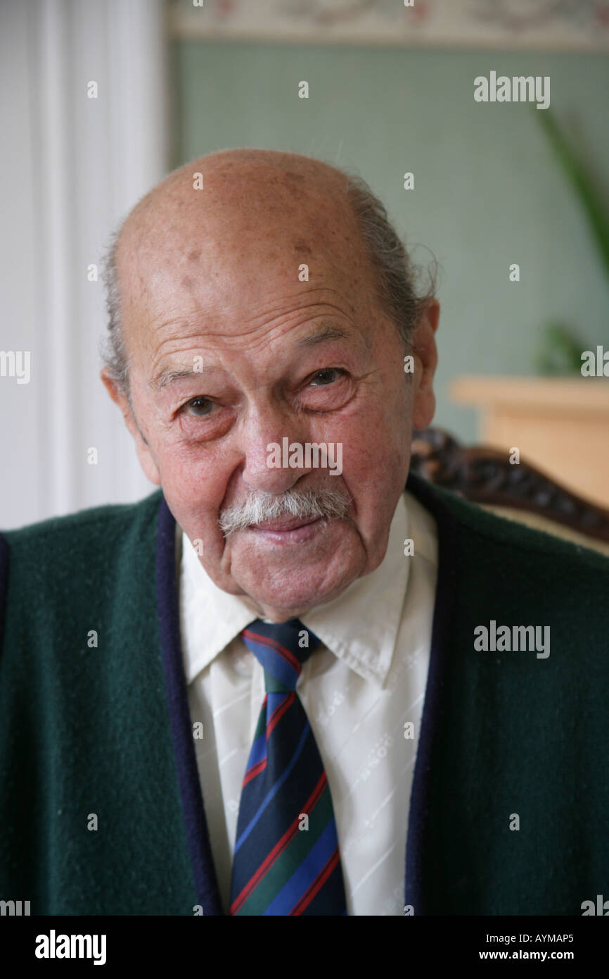 Old gentle man softly smiling Stock Photo - Alamy