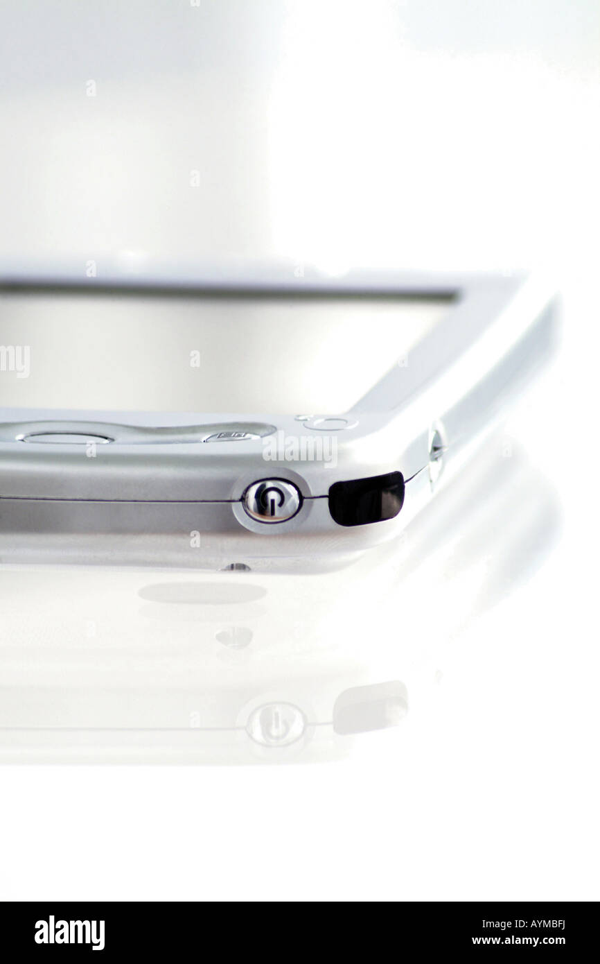 Early generic PDA reflected on glass desk surface. What business people ...