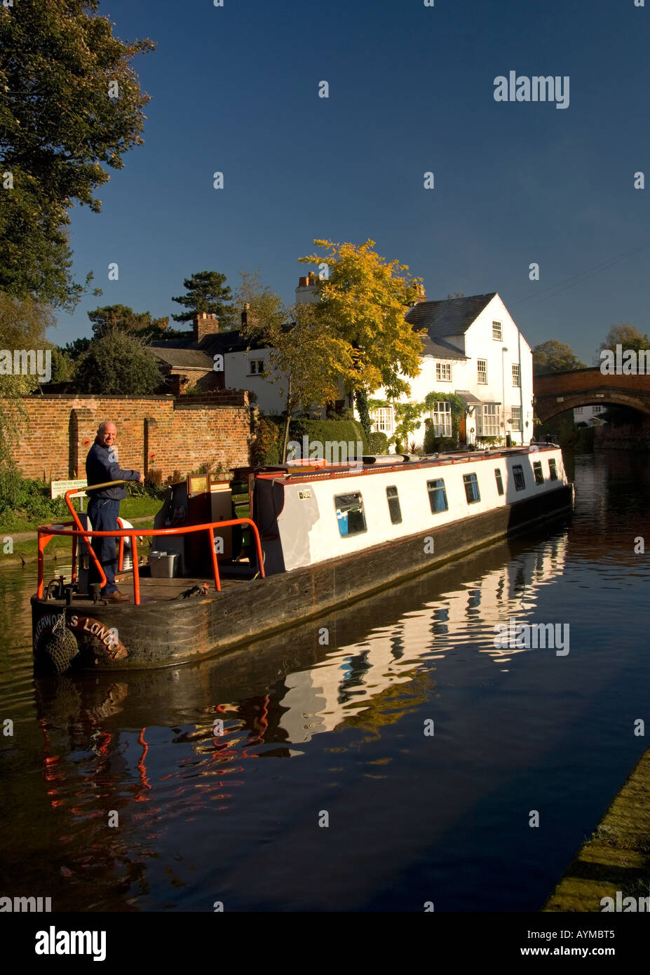 Canal Boat Passing Bridgewater House Reflected in the Bridgewater Canal ...