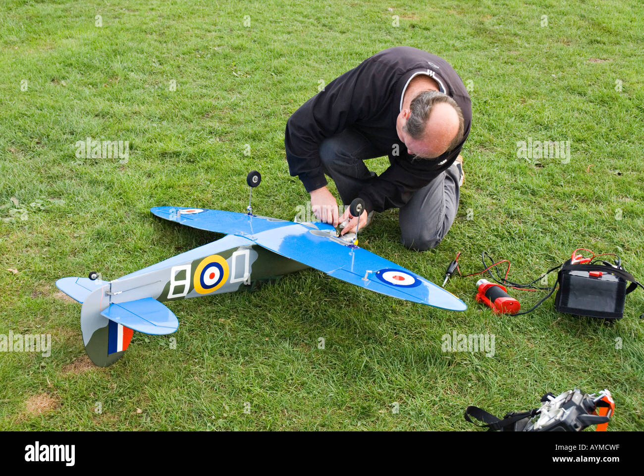 Preparing model radio controlled airplanes for flight in Epping Forest ...