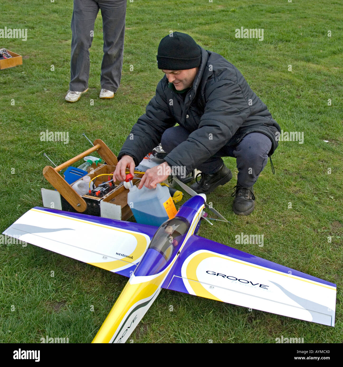Preparing model radio controlled airplanes for flight in Epping Forest ...