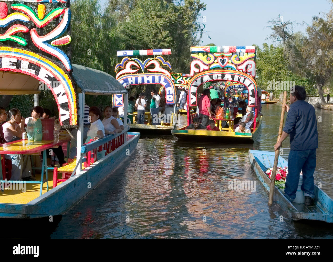 Trajineras flower boats and food seller in a chalupas on the canals of ...