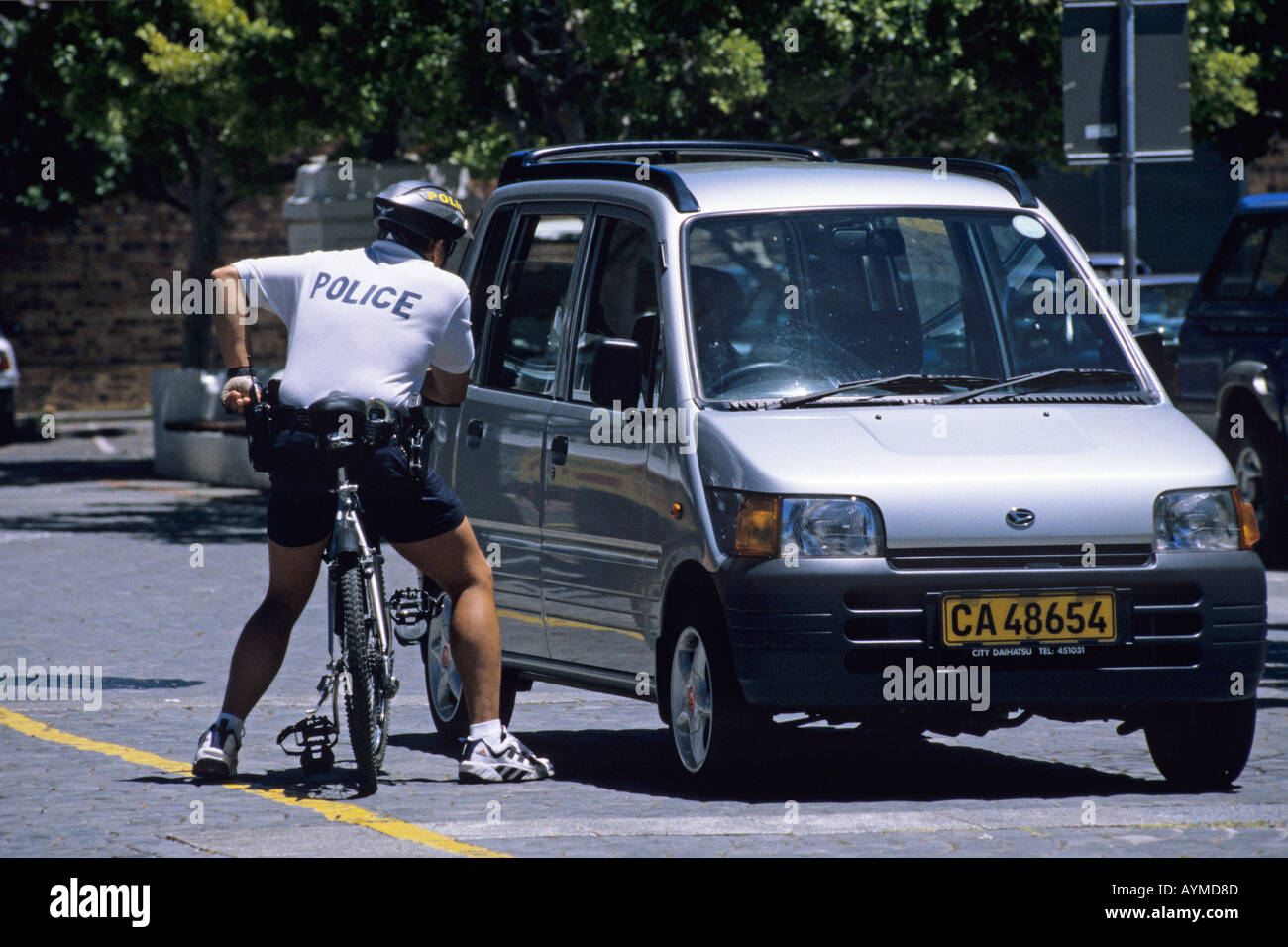 Cycle riding police officer in Simons Town Nr Cape Town western cape ...