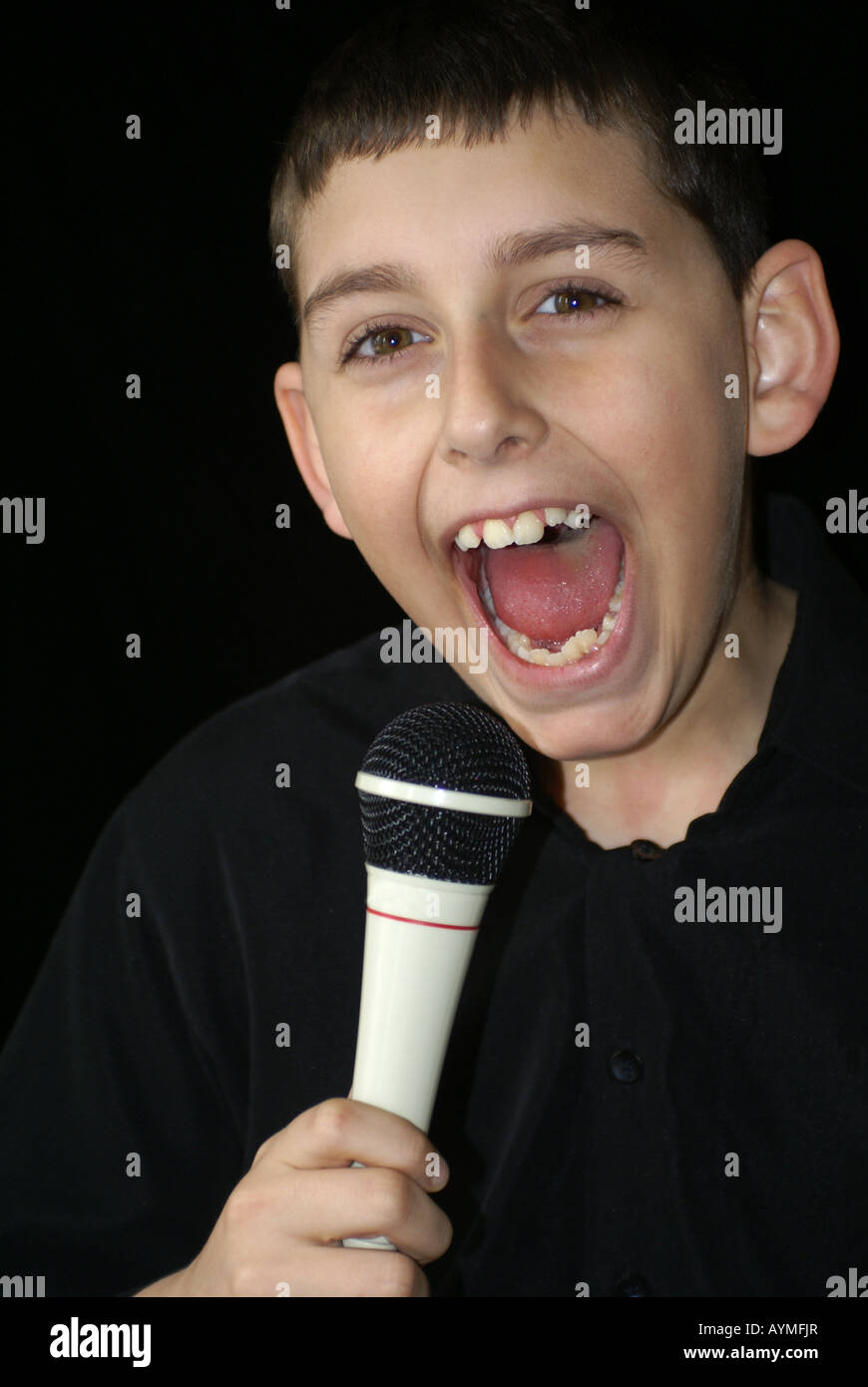 Child holding Microphone Stock Photo - Alamy