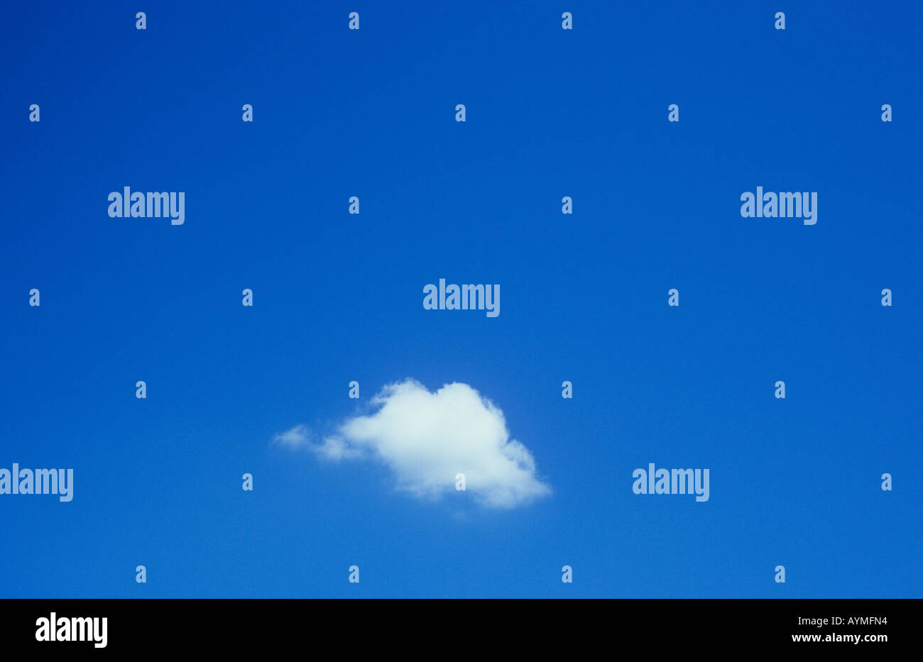 Cheeky little puff of white cumulus cloud against an otherwise ...