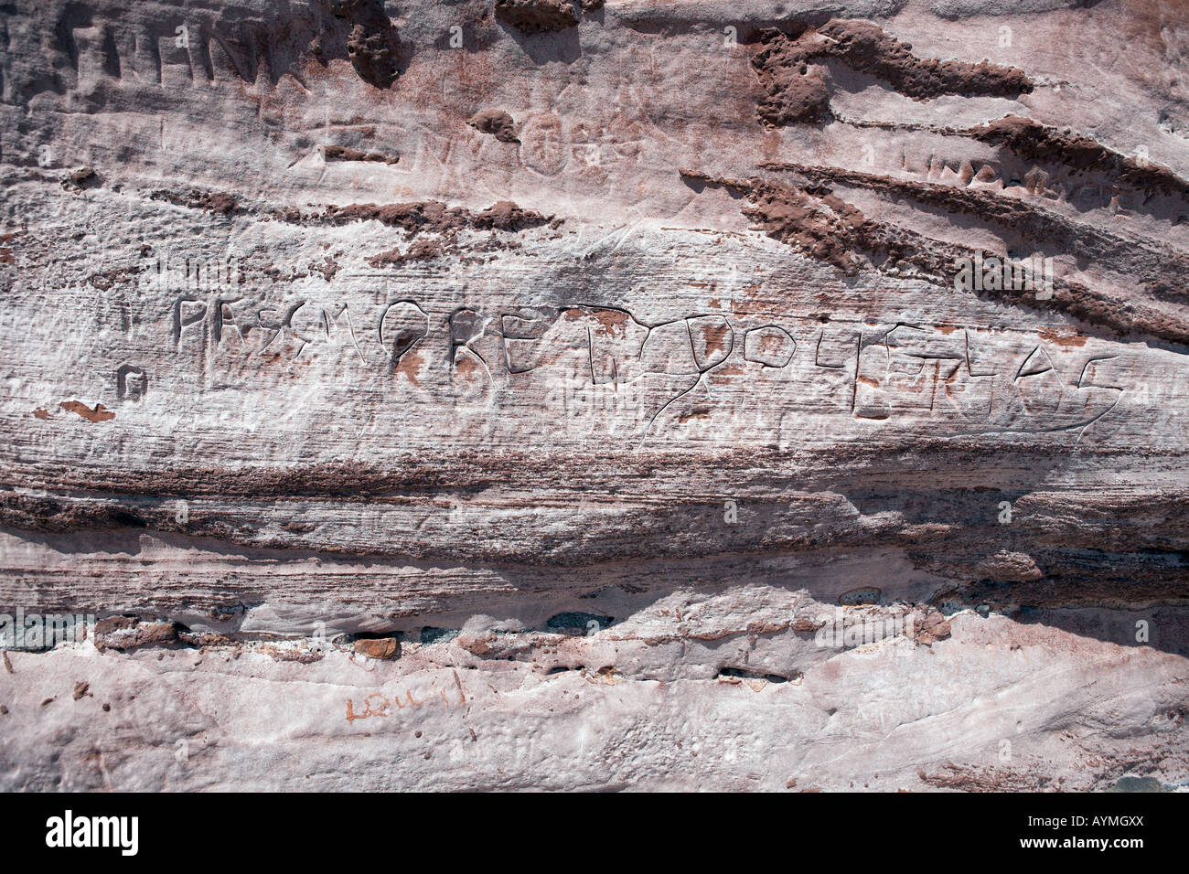 Graffiti on sandstone cliff wall Stock Photo - Alamy