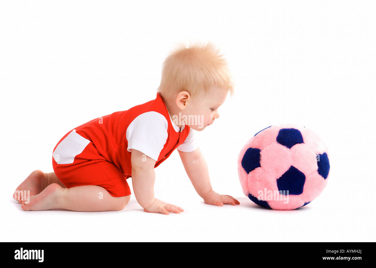 Baby boy playing football Stock Photo - Alamy