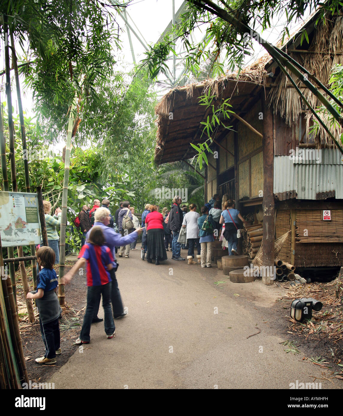 Cornwall tourism; Tourists explore the rainforest biome conservatory ...