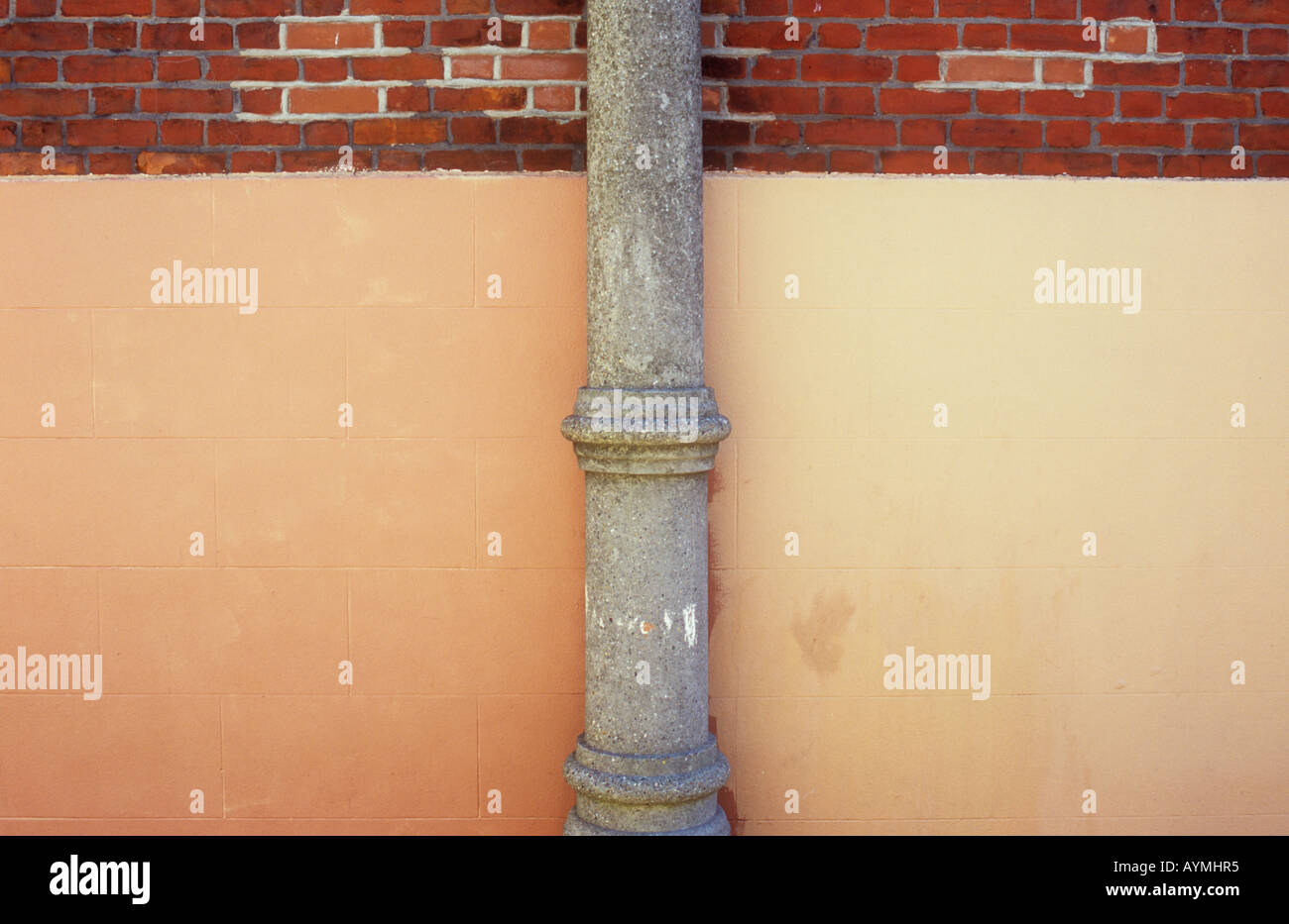 Detail of a concrete lamp post or pipe against a freshly painted ...